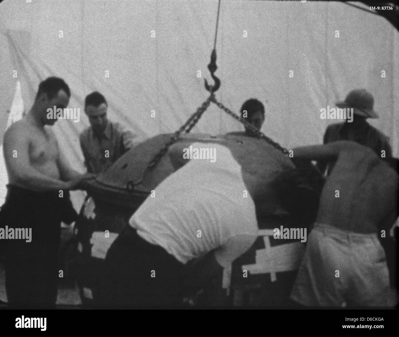 J. Robert Oppenheimer supervises the final assembly of the 'Gadget ...