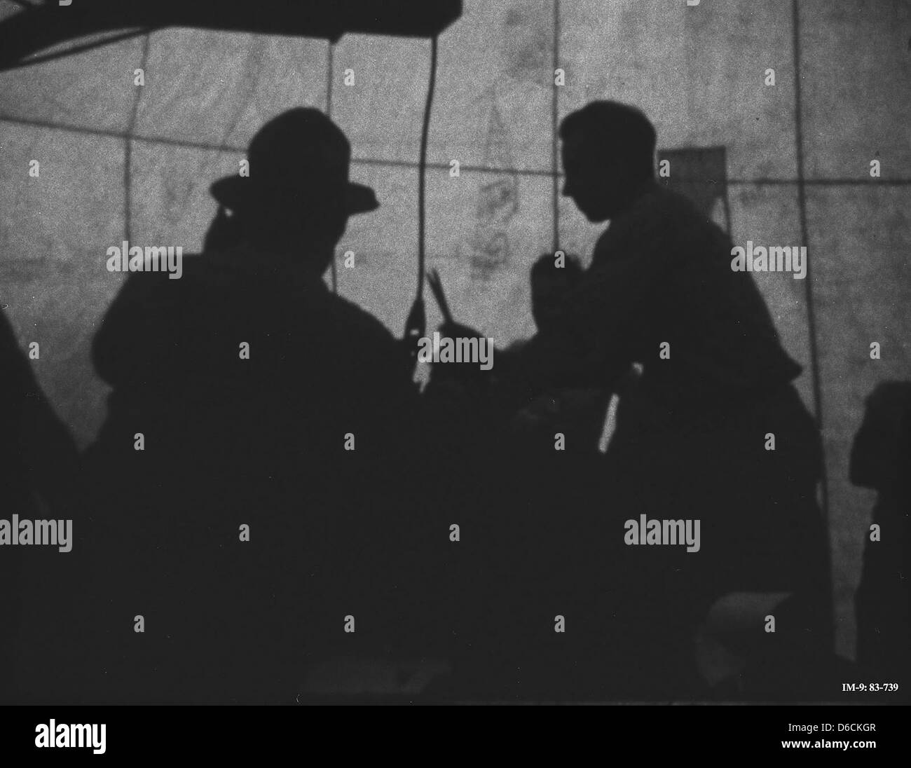 J. Robert Oppenheimer oversees the final assembly of the Gadget, the ...
