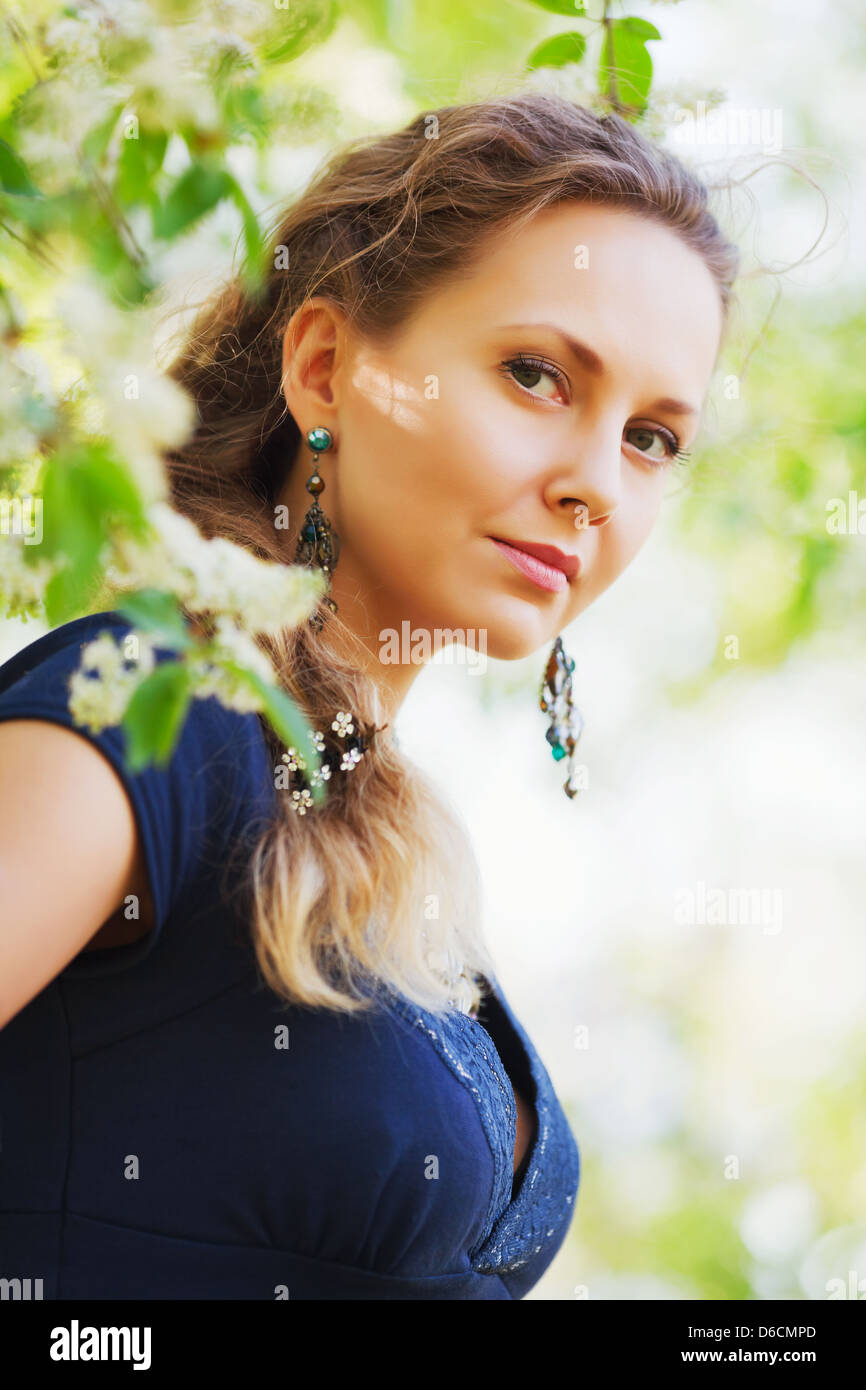 Beautiful woman in a spring garden Stock Photo - Alamy