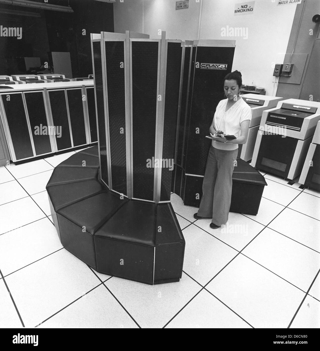 A laboratory worker is seen monitoring a CRAY supercomputer at Los ...