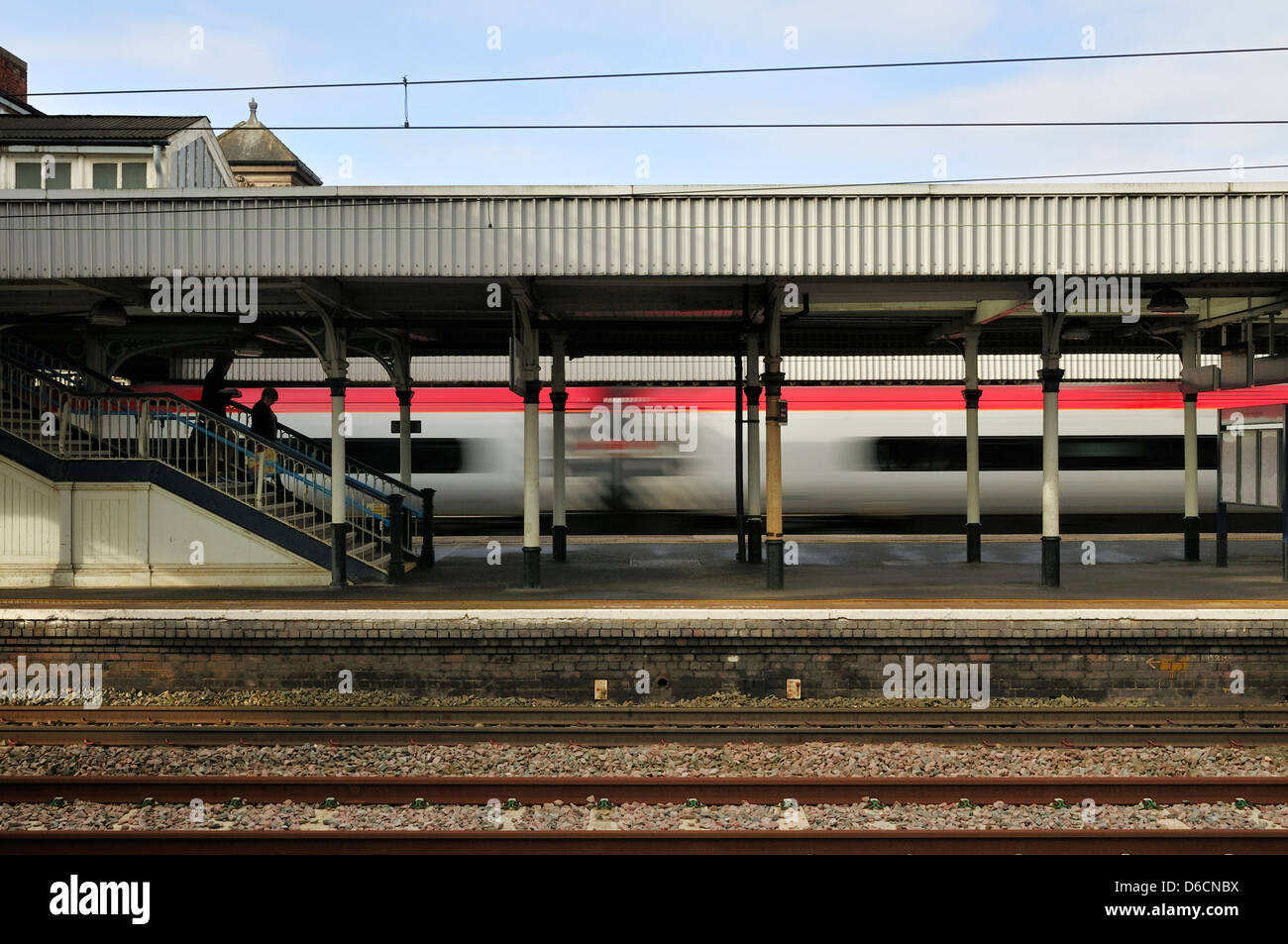 Virgin Pendolino train passing through Nuneaton Station at high speed ...