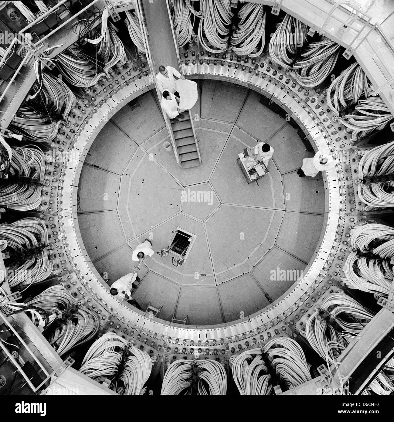 This image shows laboratory staff working on the Scyllac project at Los ...