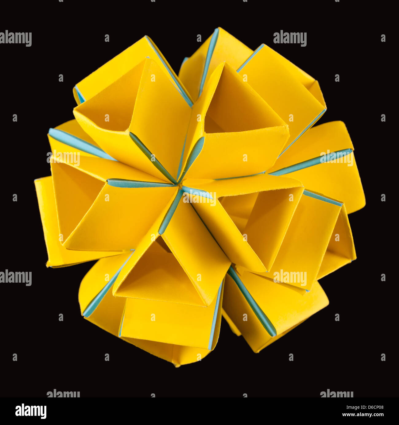 Yellow blue paper origami kusudama isolated on black Stock Photo - Alamy