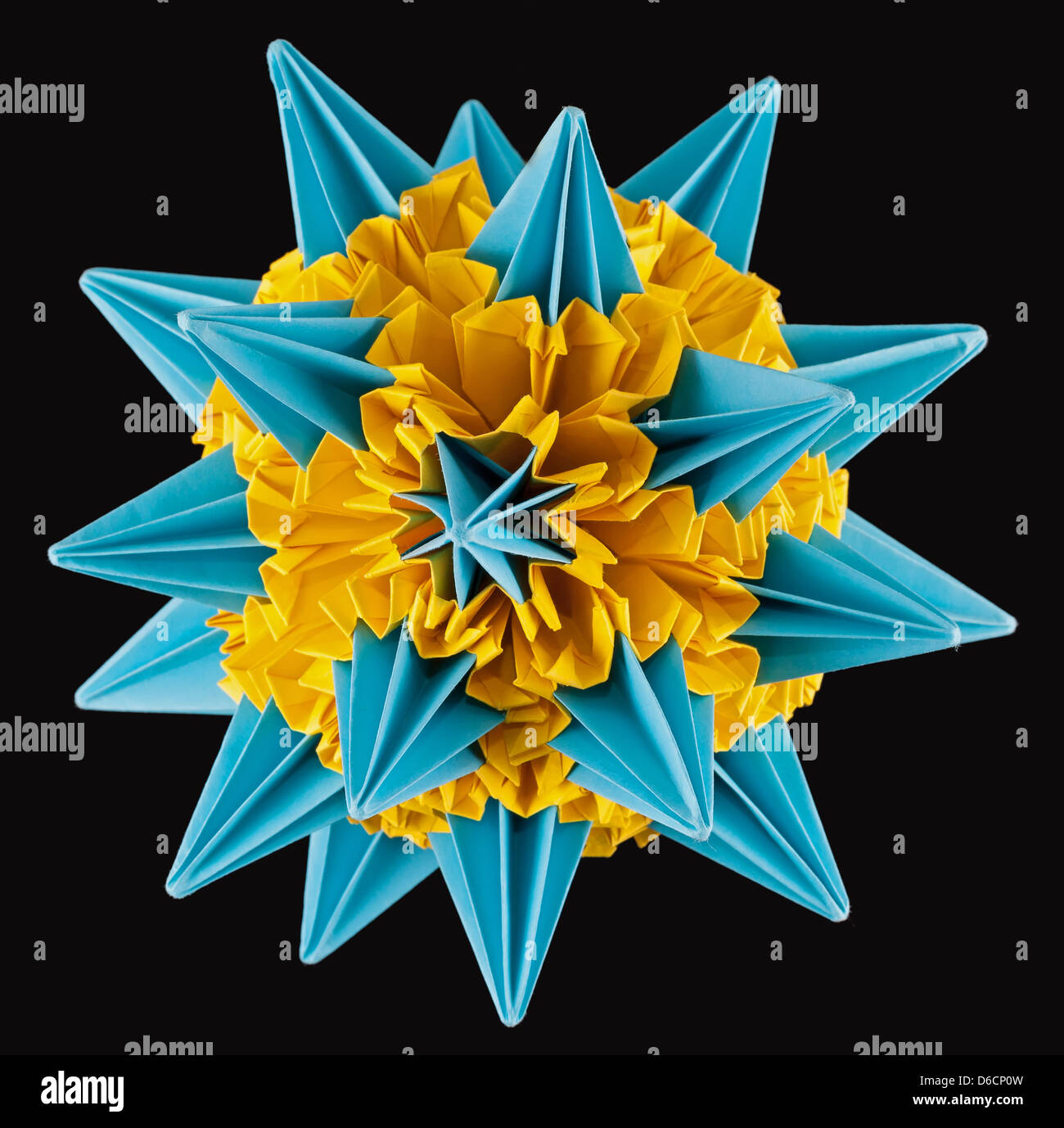 Blue yellow paper origami kusudama isolated on black Stock Photo - Alamy