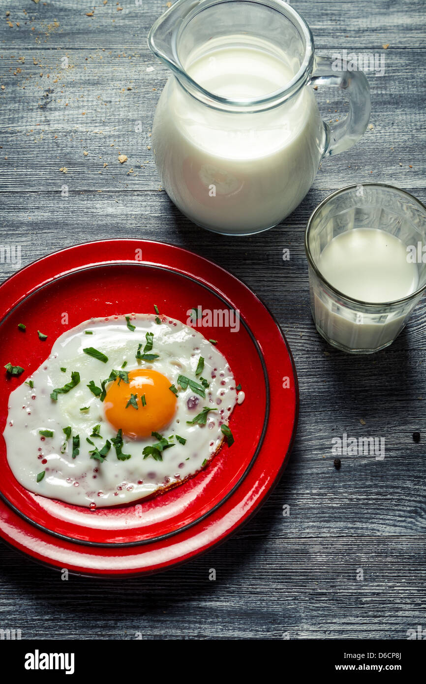 Country style simple breakfast with eggs and milk Stock Photo - Alamy