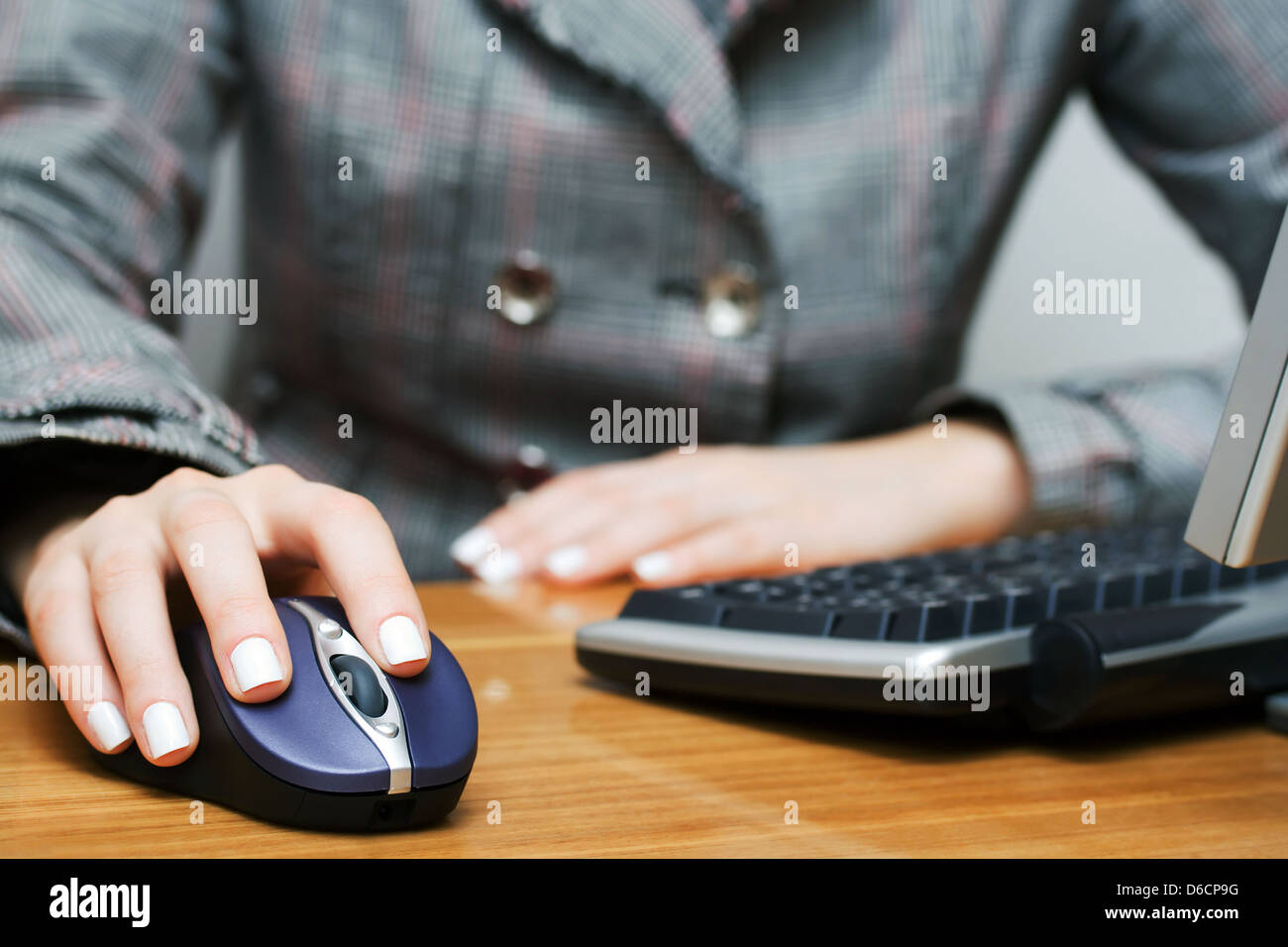 Female hands using computer Stock Photo - Alamy