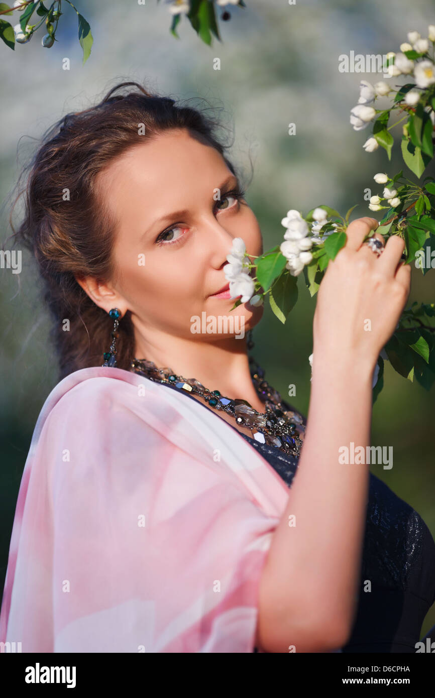Beautiful woman in a spring garden Stock Photo - Alamy