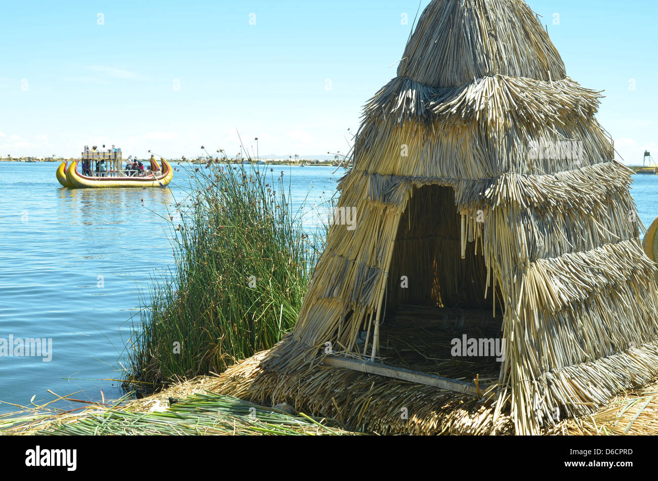 Local houses and boats made of totora reeds on the Uros Islands of Lake ...