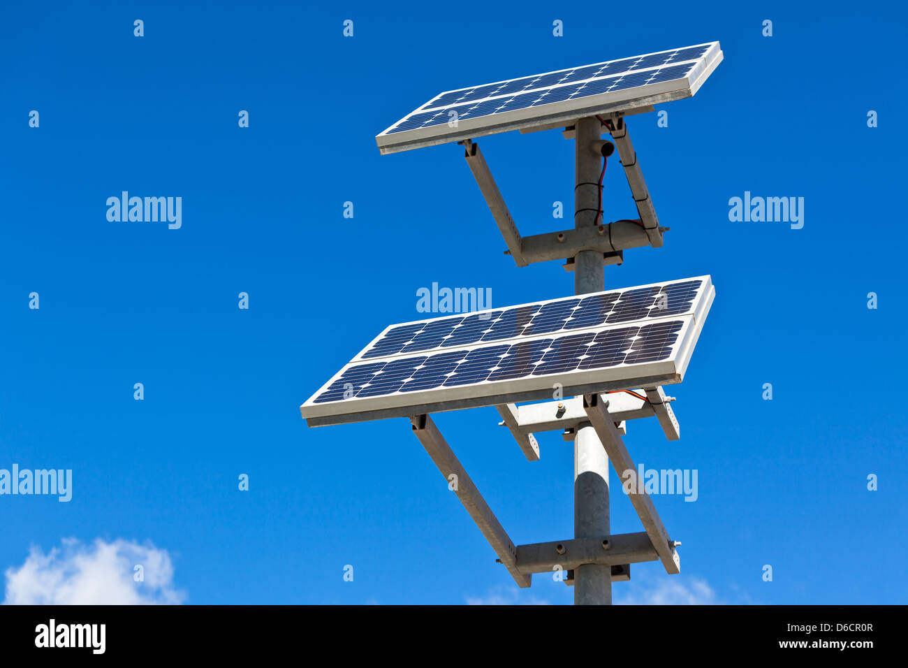 Solar panels on bright blue sky background. Renewable Energy ...