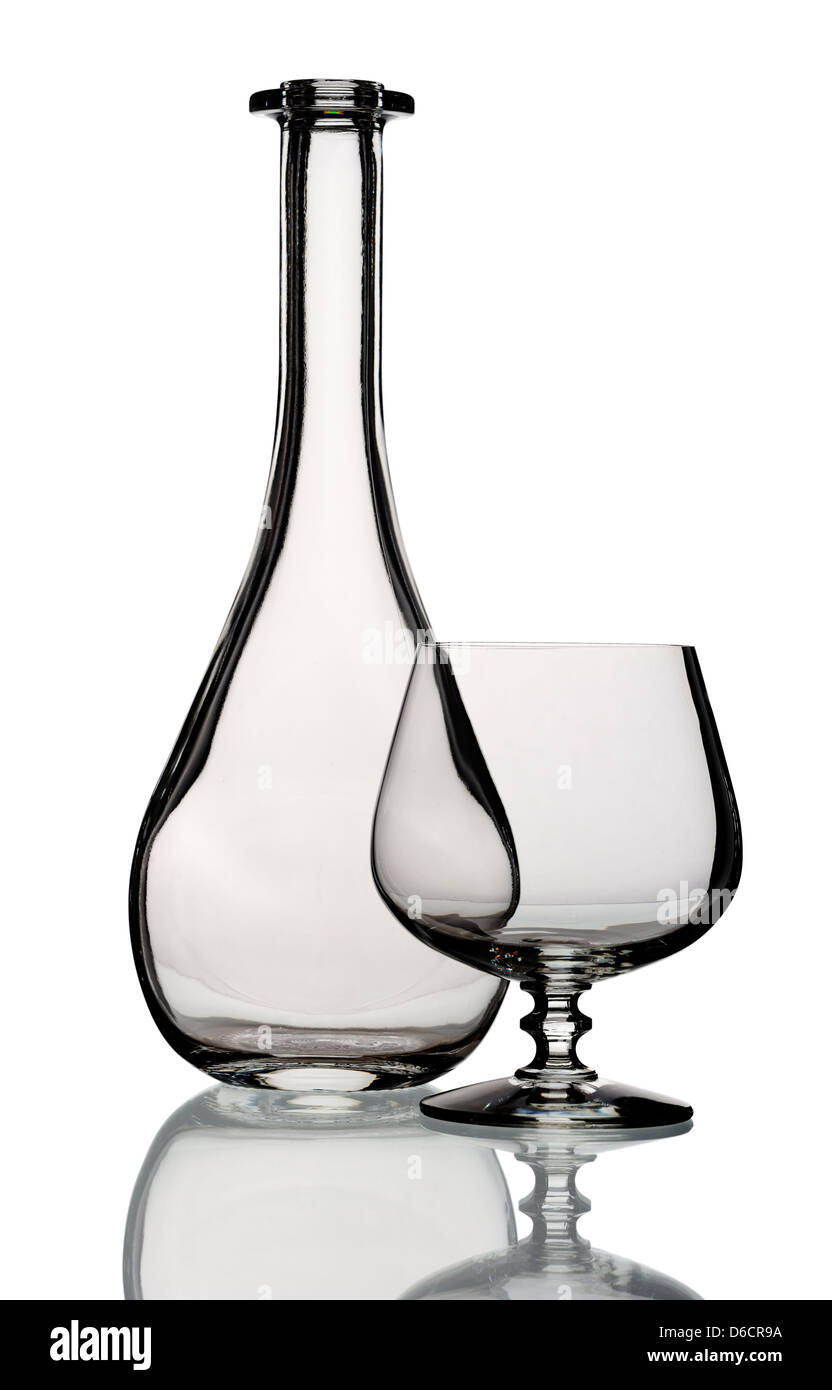 Glass bottle and goblet, isolated Stock Photo - Alamy