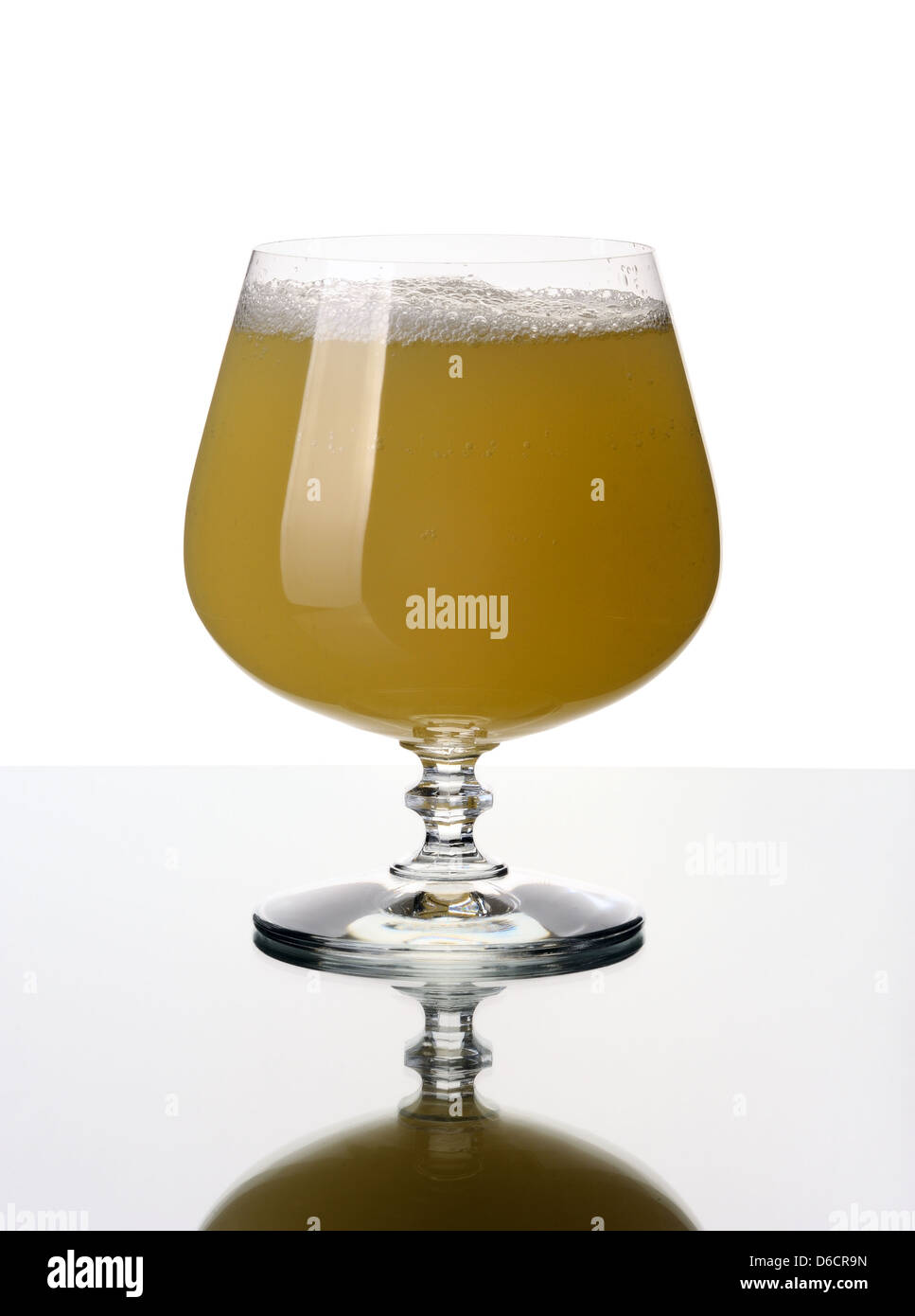 Glass goblet with a juice, isolated Stock Photo - Alamy