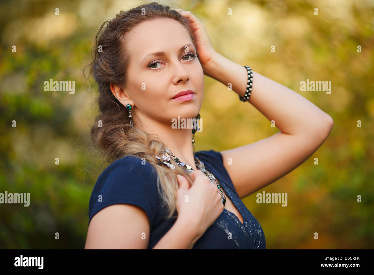 Beautiful woman in a spring garden Stock Photo - Alamy