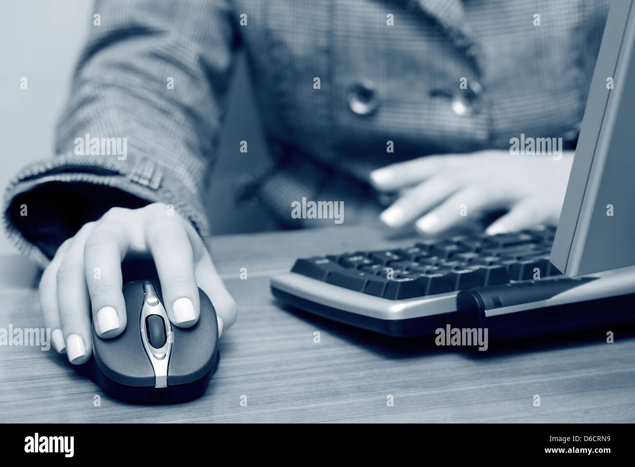 Female hand holding computer mouse Stock Photo - Alamy