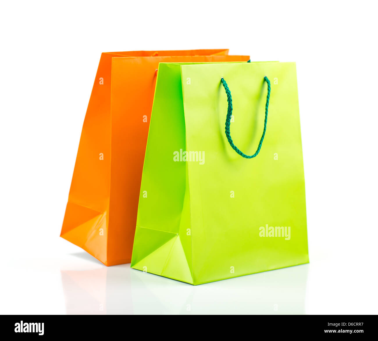 Two paper Shopping bags with reflection on white Stock Photo - Alamy