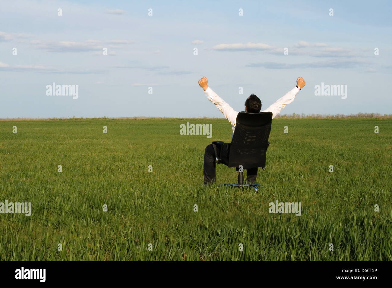 businessman take energy from nature Stock Photo - Alamy
