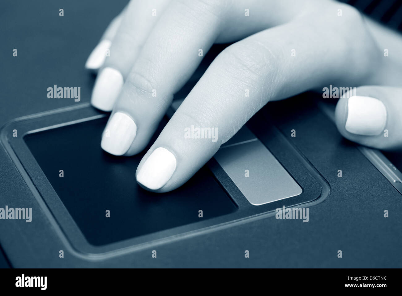 Female hand using touchpad Stock Photo - Alamy