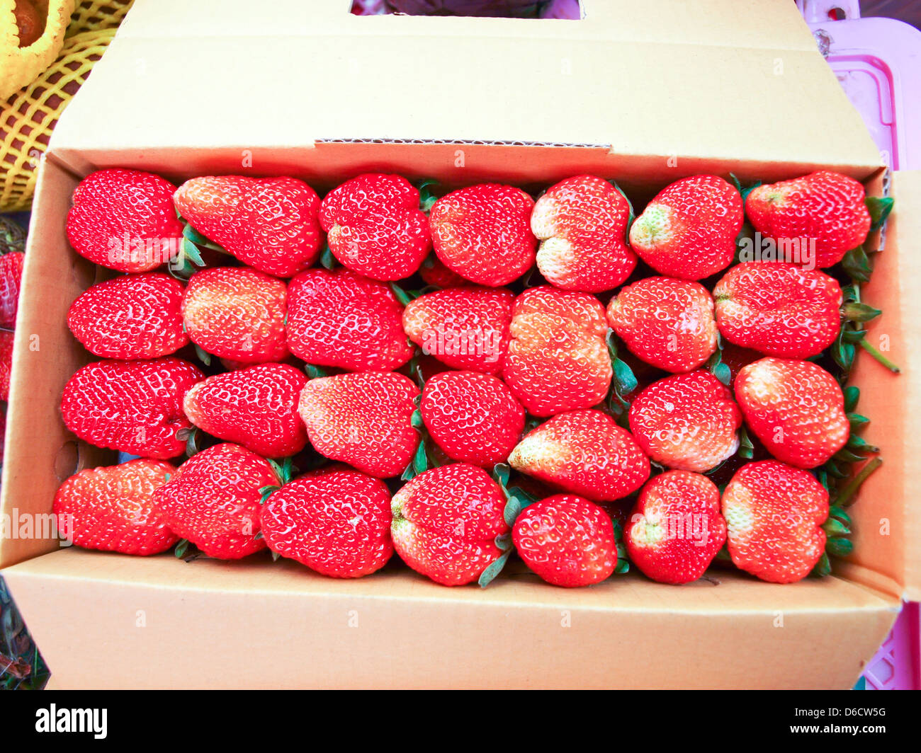 strawberry in paper box Stock Photo - Alamy