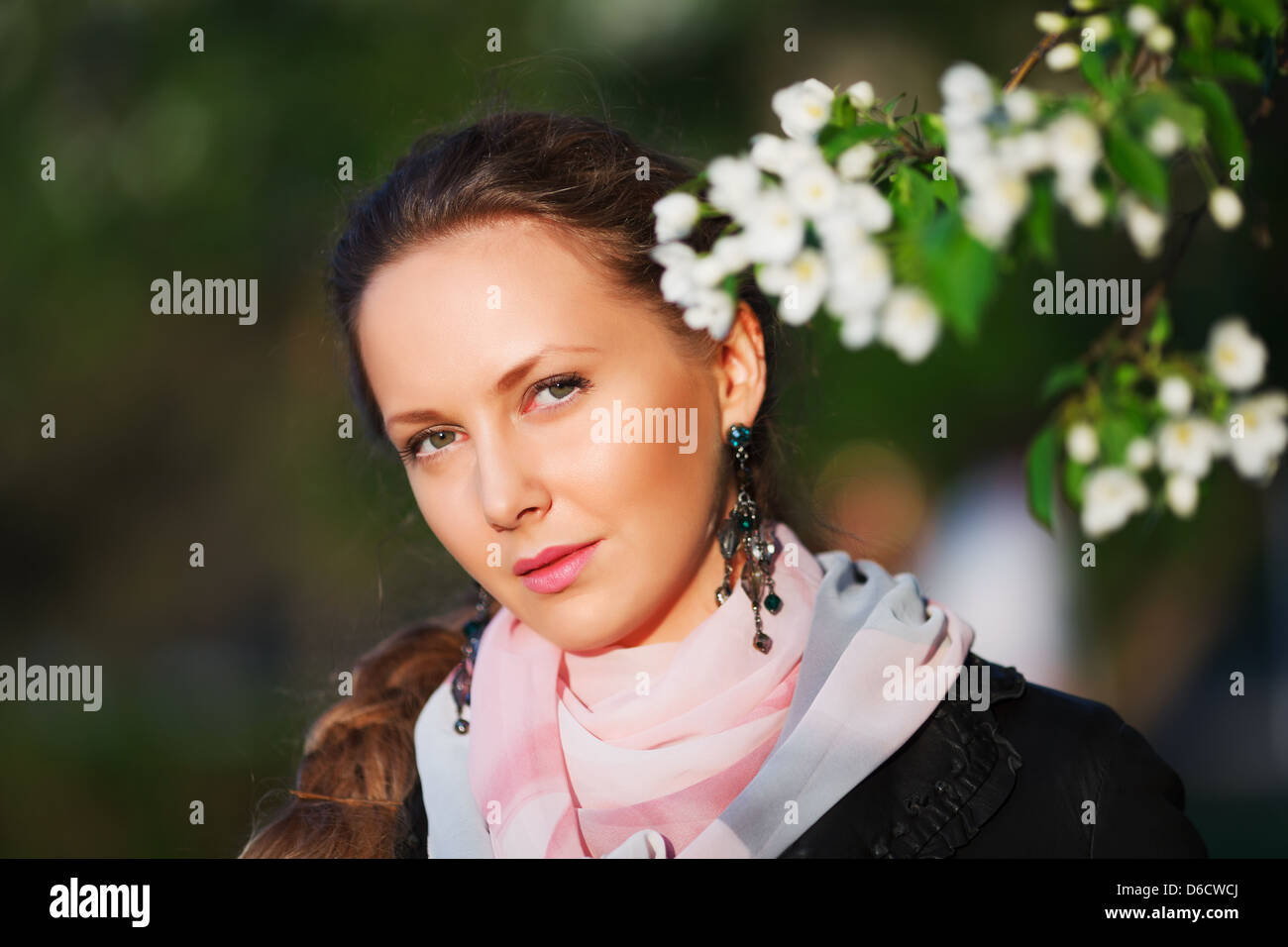Beautiful woman in a spring garden Stock Photo - Alamy