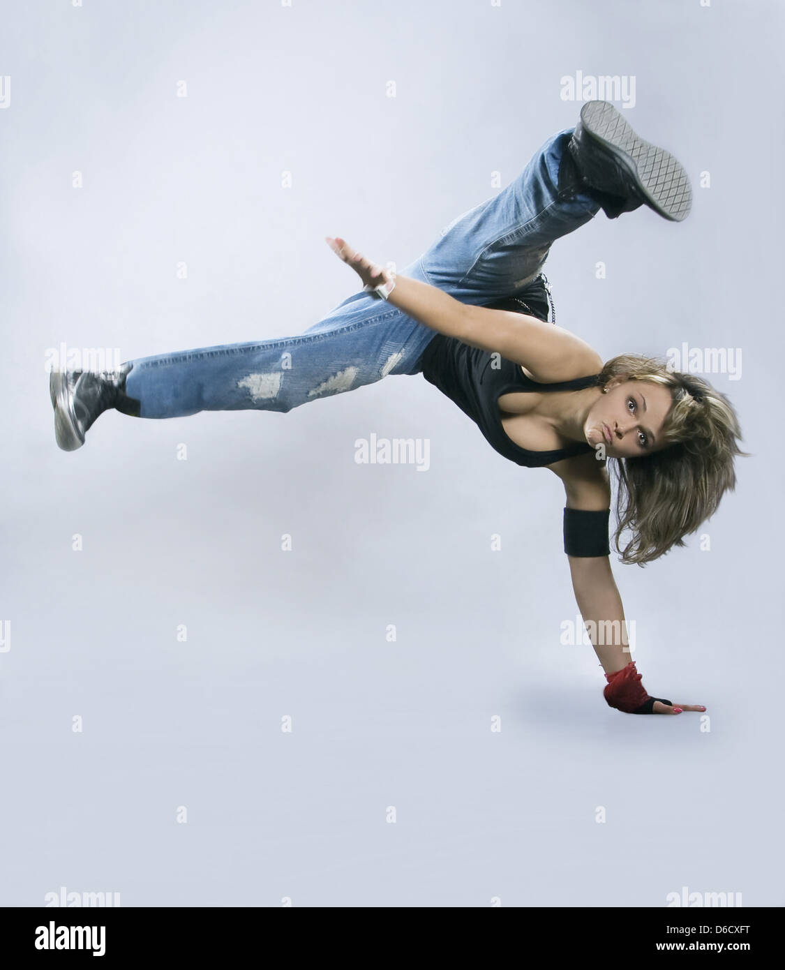 Teenage girl dancing breakdance in action Stock Photo - Alamy