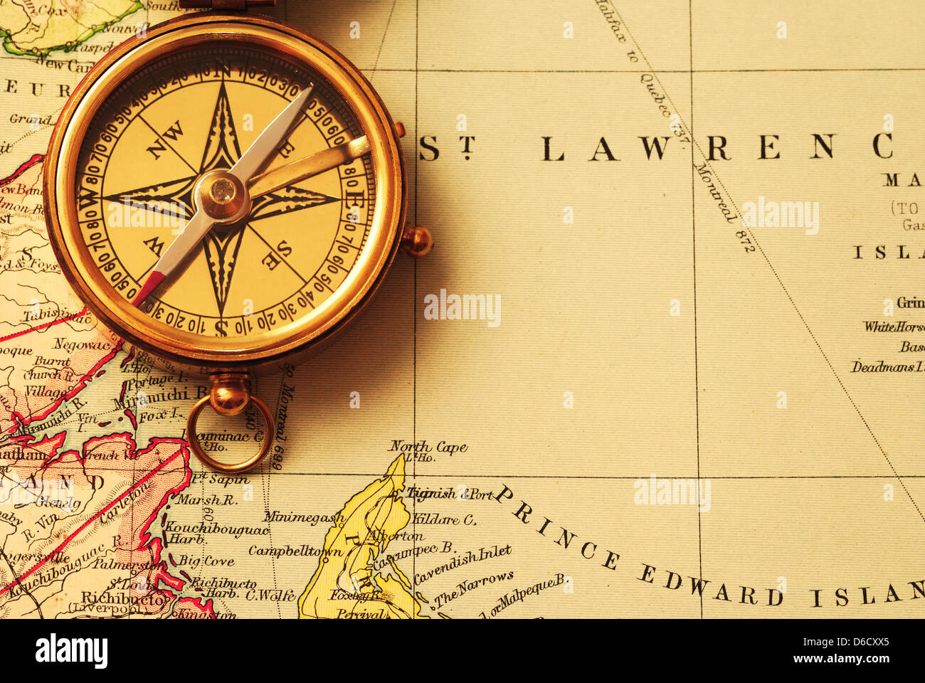 Antique brass compass over old Canadian map Stock Photo - Alamy
