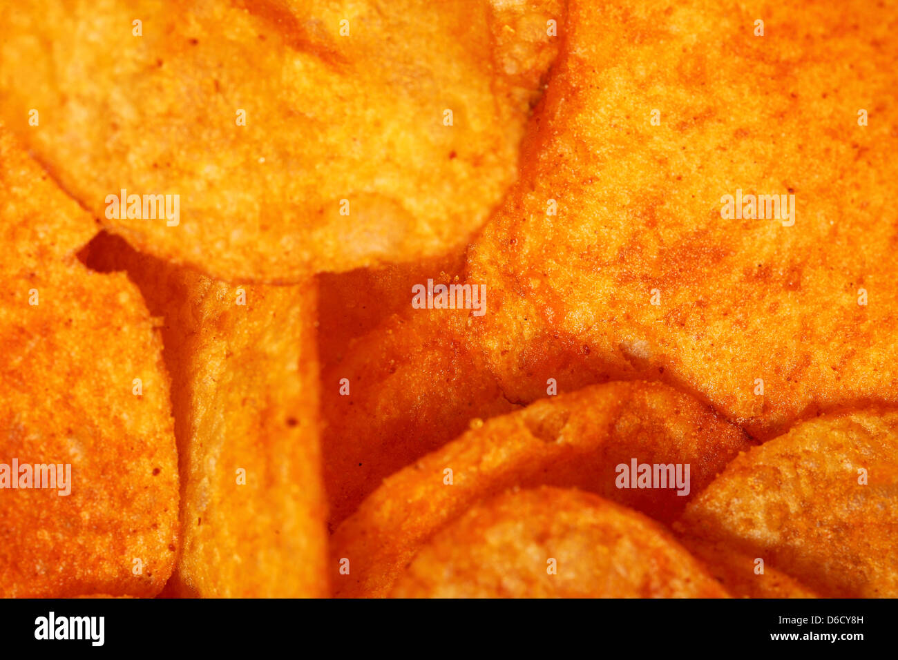 Crisps. Close up potato paprika chips as background Stock Photo - Alamy