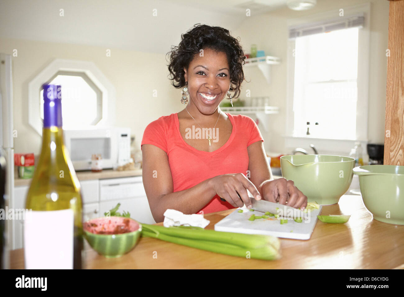 Girl cooking dinner in kitchen Stock Photo - Alamy