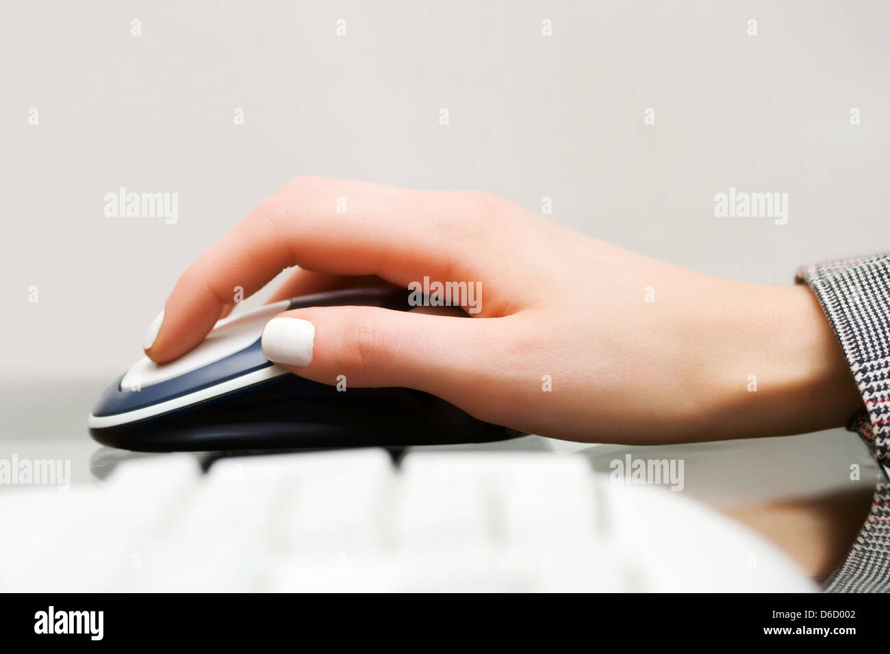 Female hand holding computer mouse Stock Photo - Alamy