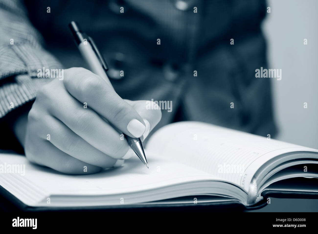 Female hand writing Stock Photo - Alamy