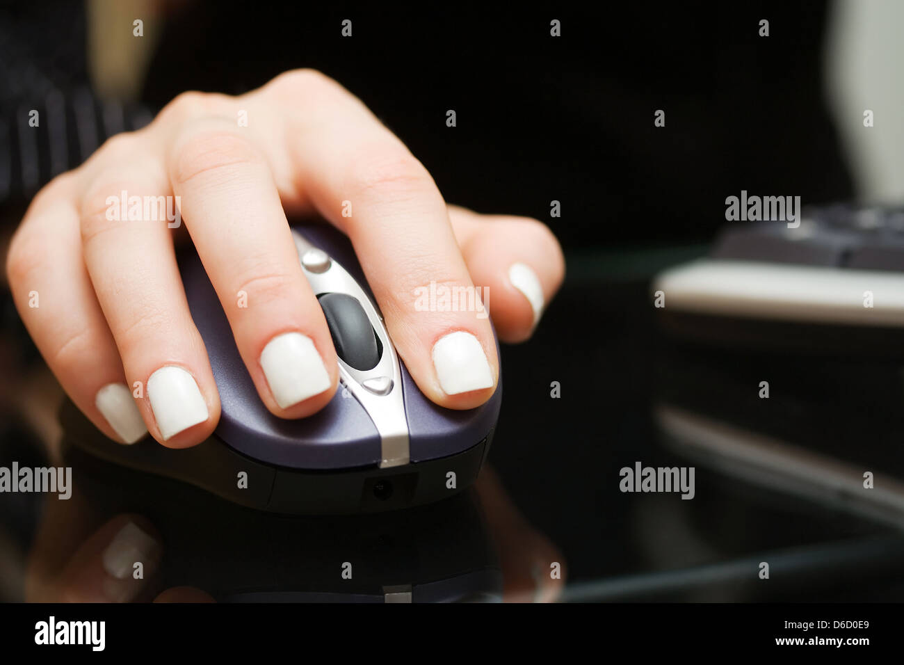 Female hand holding computer mouse Stock Photo - Alamy