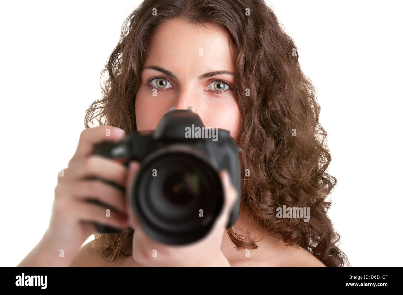 Woman holding an SLR camera, getting ready to take a picture, isolated ...