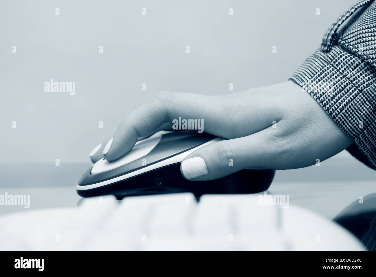 Female hand holding computer mouse Stock Photo - Alamy