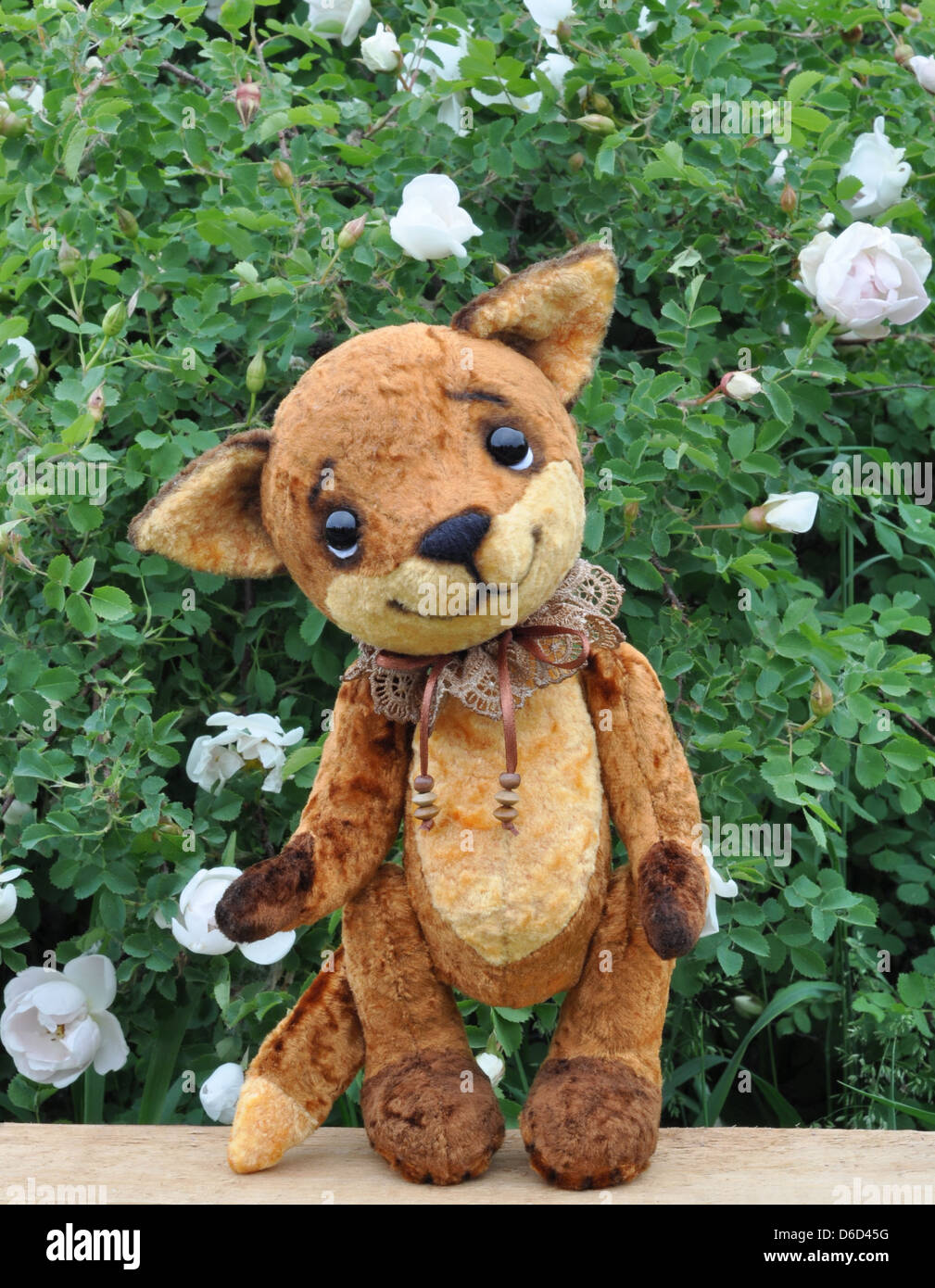 Ron fox cub and flowers Stock Photo - Alamy