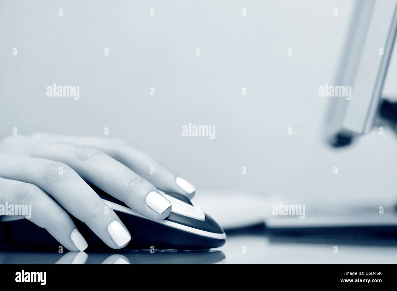 Female hand holding computer mouse Stock Photo - Alamy