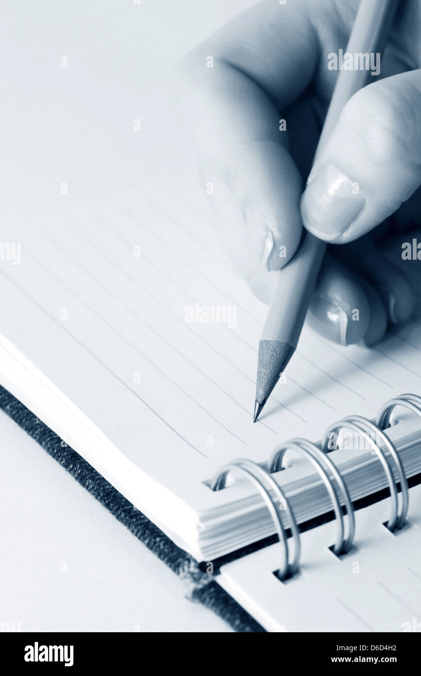 Female hand writing Stock Photo - Alamy