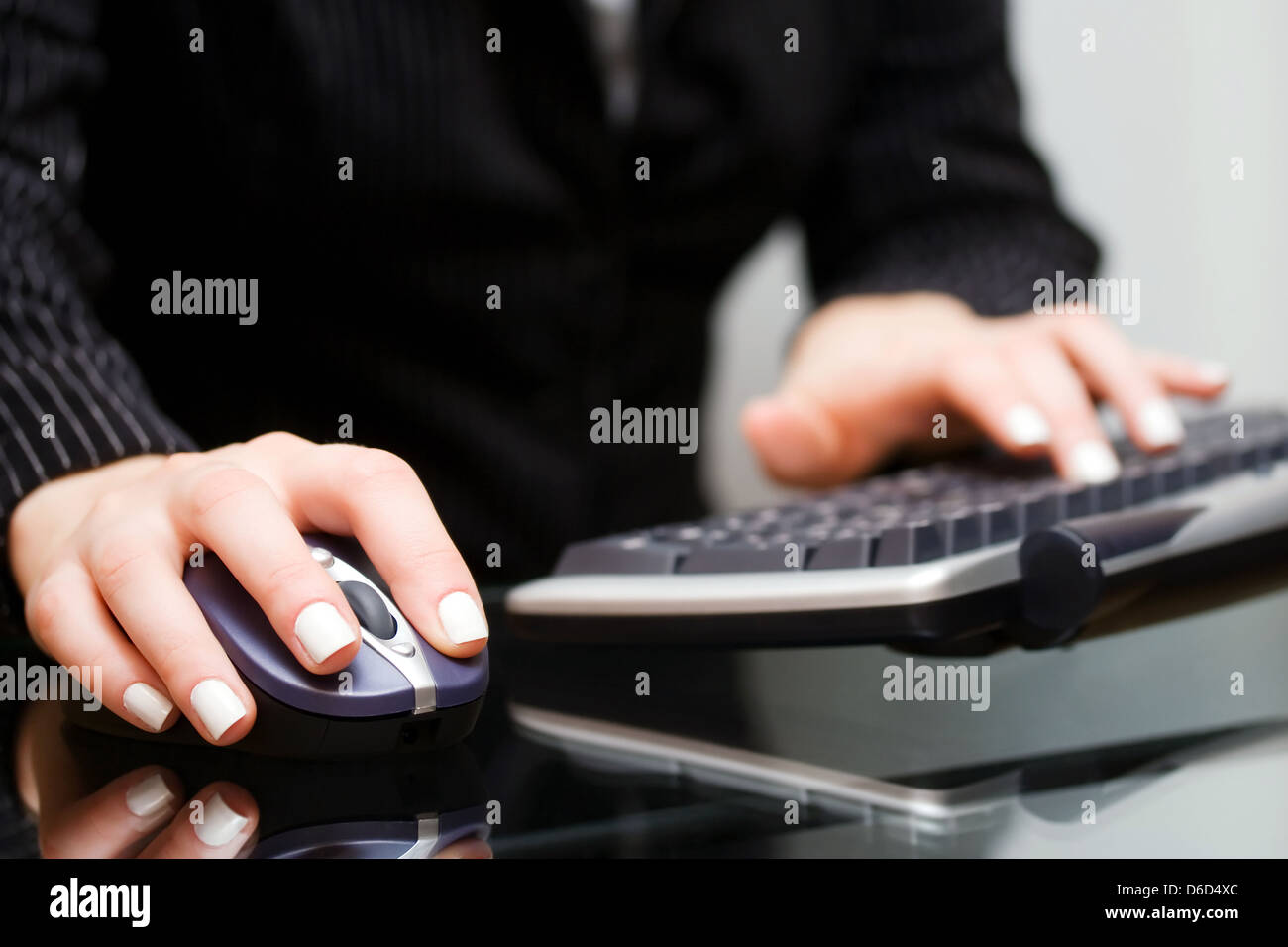 Female hands using computer Stock Photo - Alamy