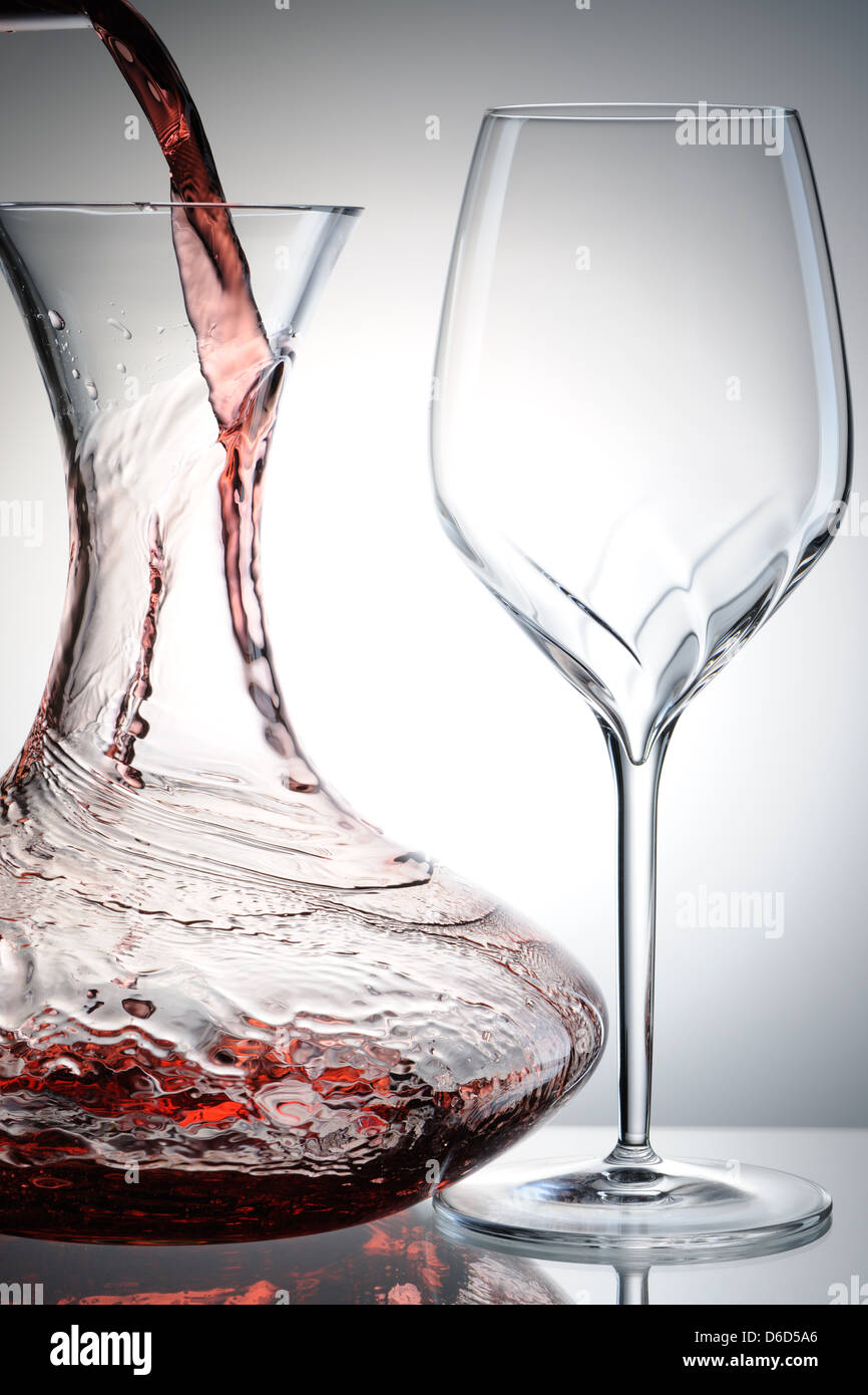 Pouring wine into decanter Stock Photo - Alamy