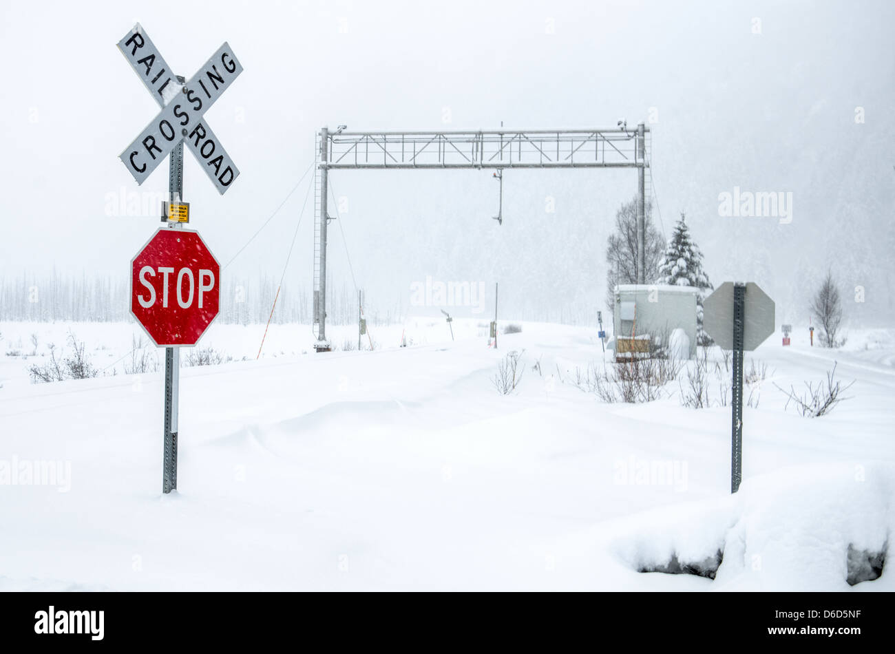 Snow covered red and white stop sign hi-res stock photography and ...