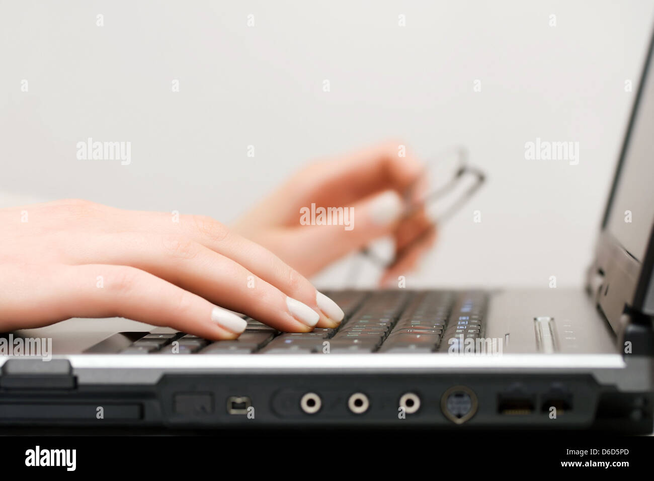 Female hands using laptop Stock Photo - Alamy