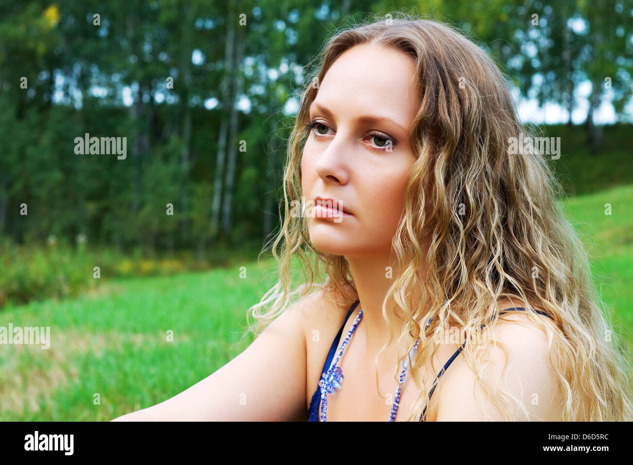 Sad young woman outdoors Stock Photo - Alamy