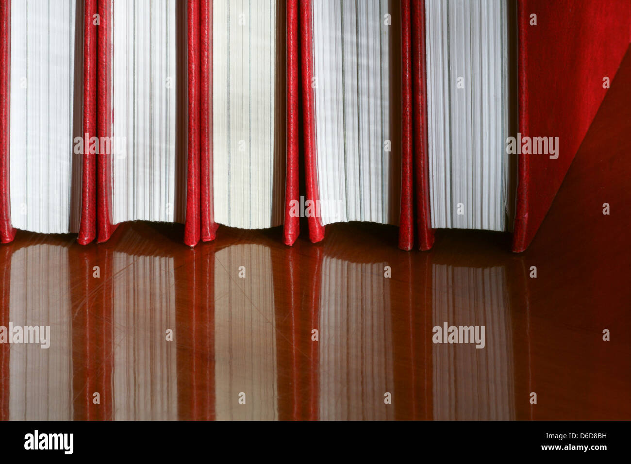 Five red books Stock Photo - Alamy