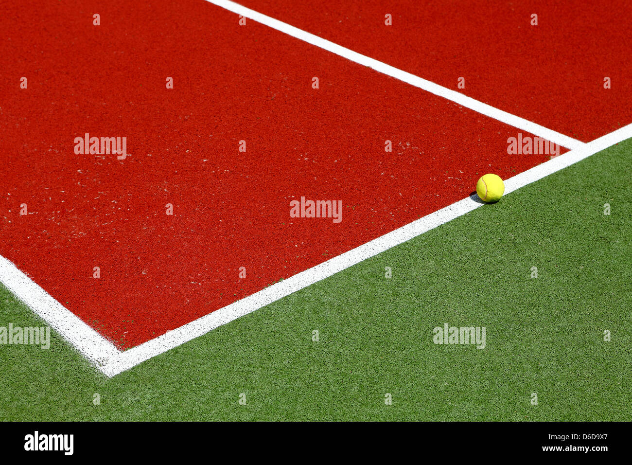 Corner of the tennis court with ball Stock Photo - Alamy