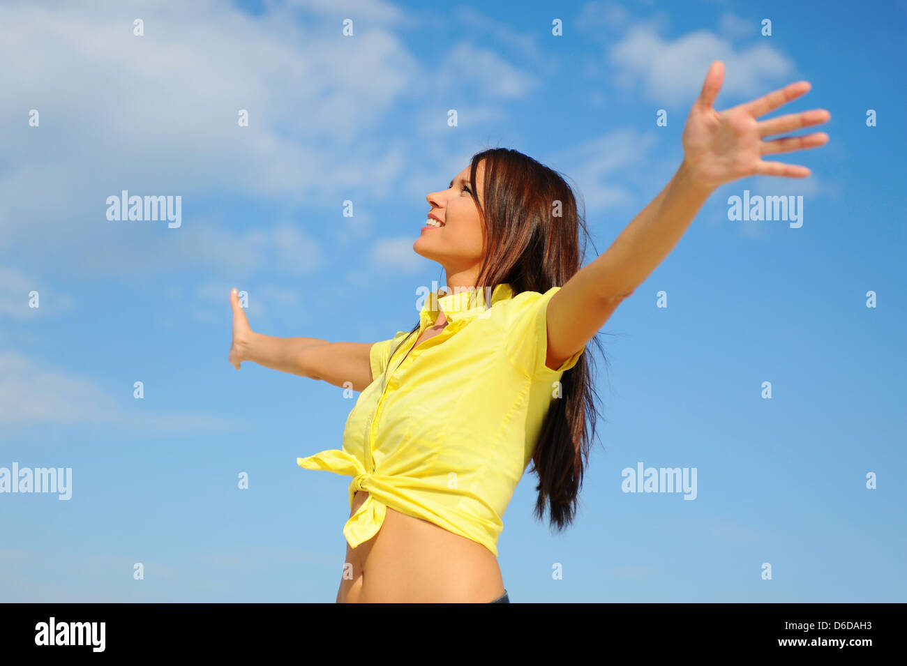 Beautiful Woman over blue Sky Stock Photo - Alamy