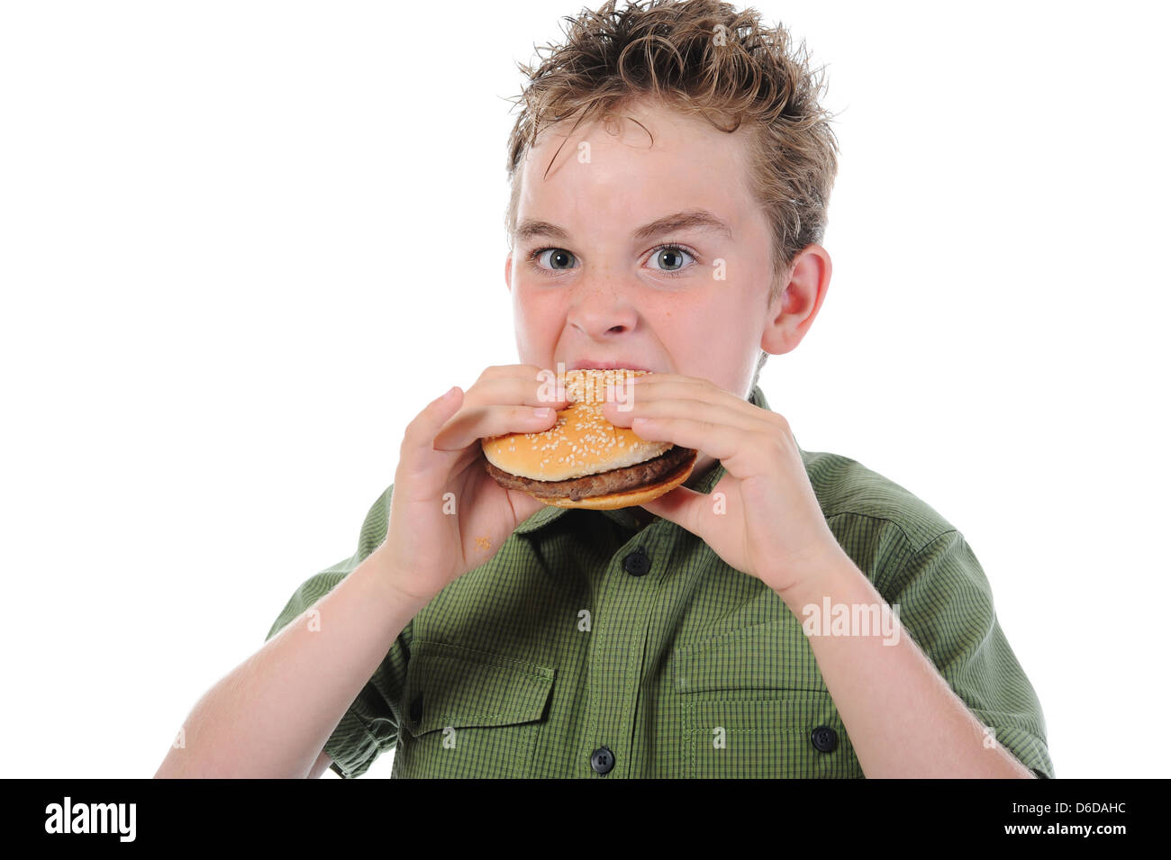 Little boy eating a hamburger Stock Photo - Alamy