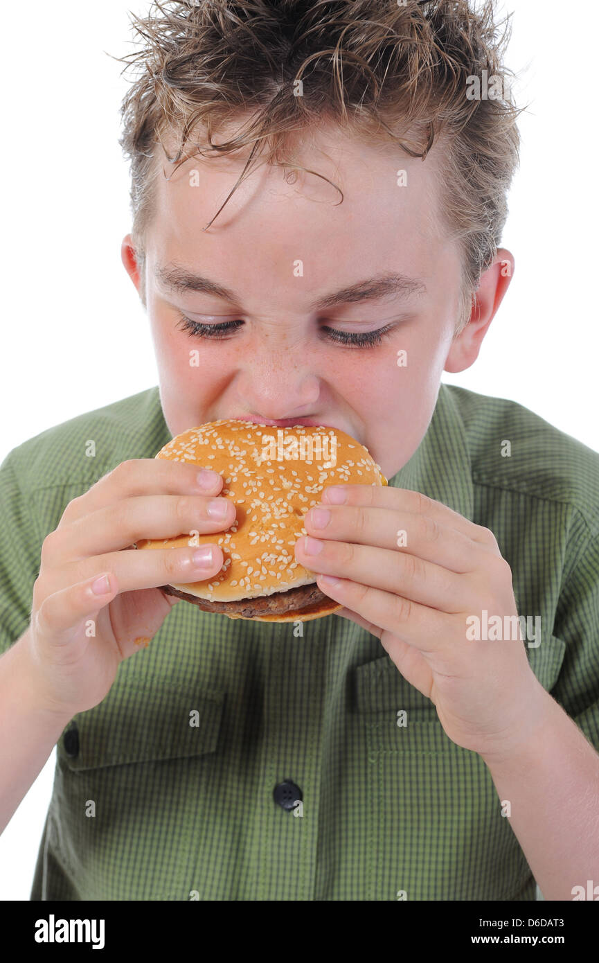 Little boy eating a hamburger Stock Photo - Alamy