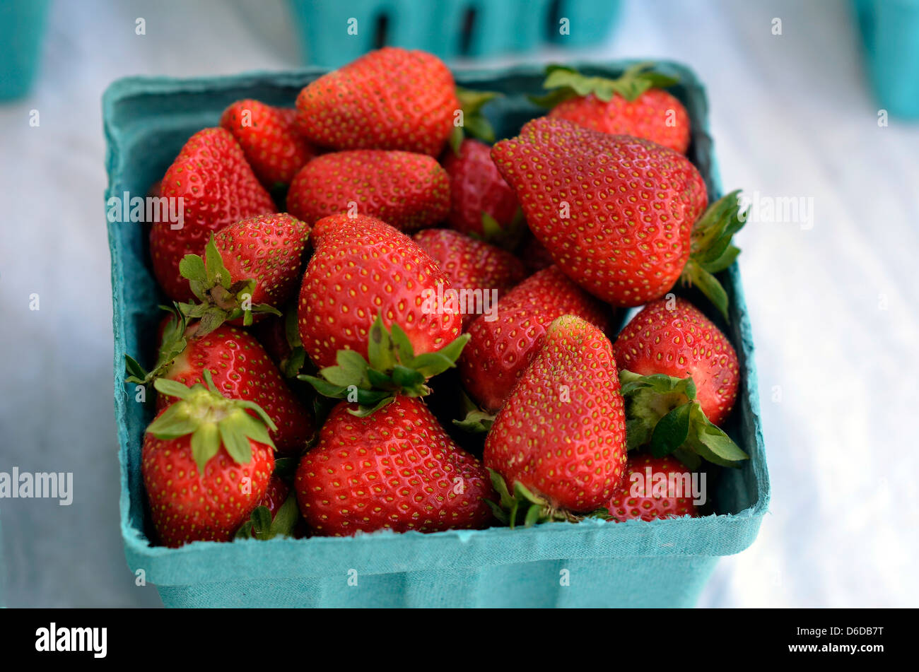 Strawberries in blue farm box Stock Photo - Alamy