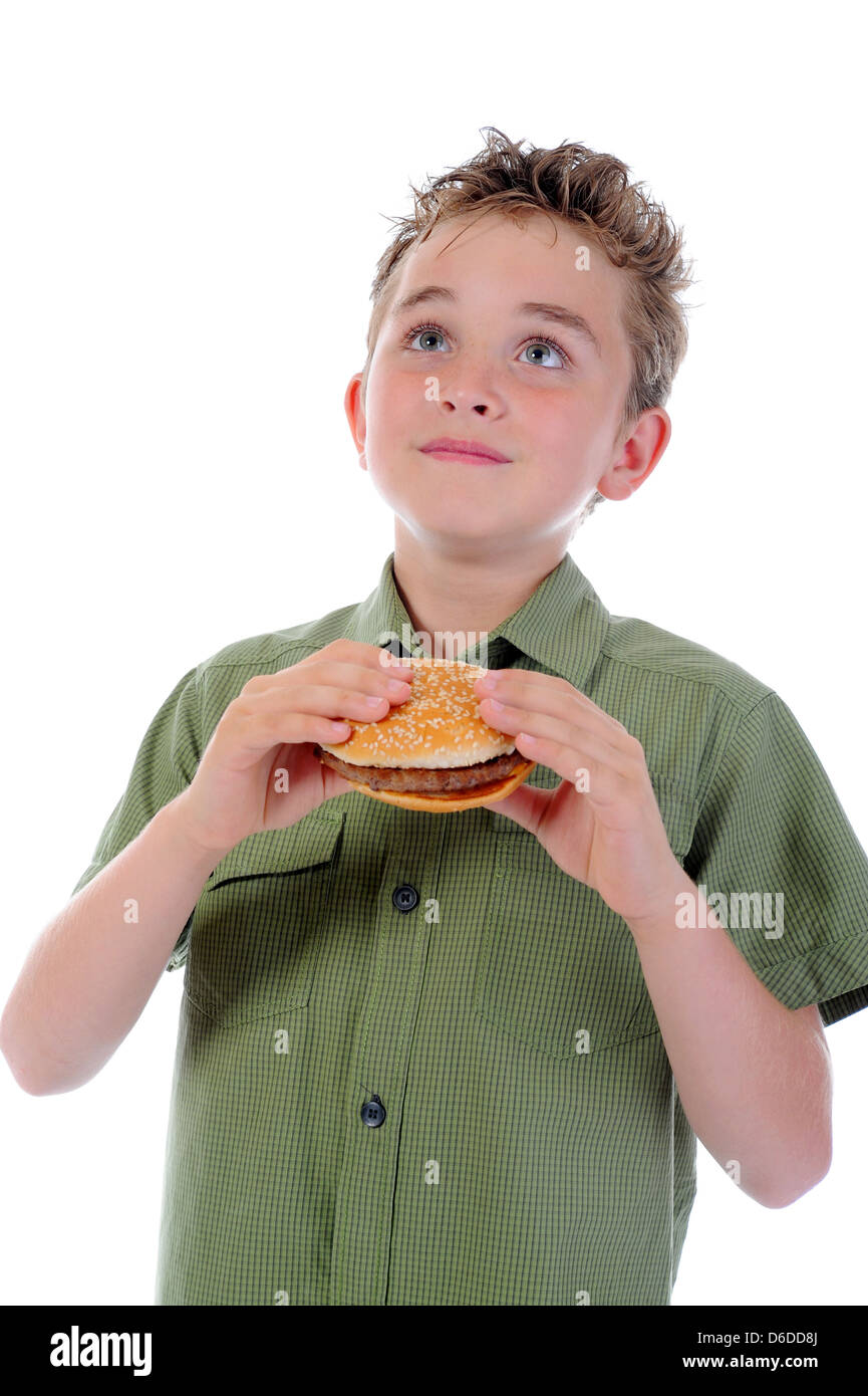 Little boy eating a hamburger Stock Photo - Alamy