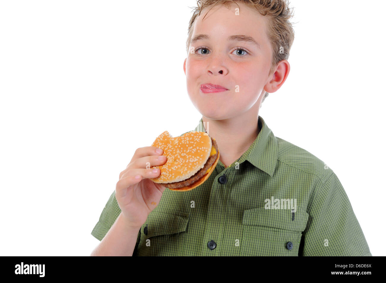 Little boy eating a hamburger Stock Photo - Alamy