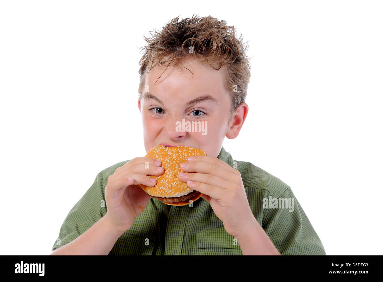 Little boy eating a hamburger Stock Photo - Alamy