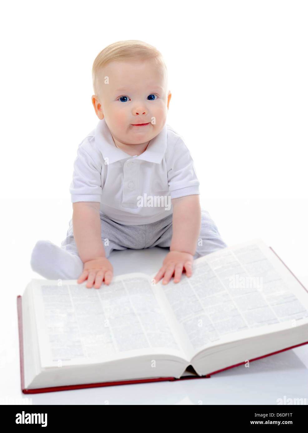 Little boy reads a big book Stock Photo - Alamy