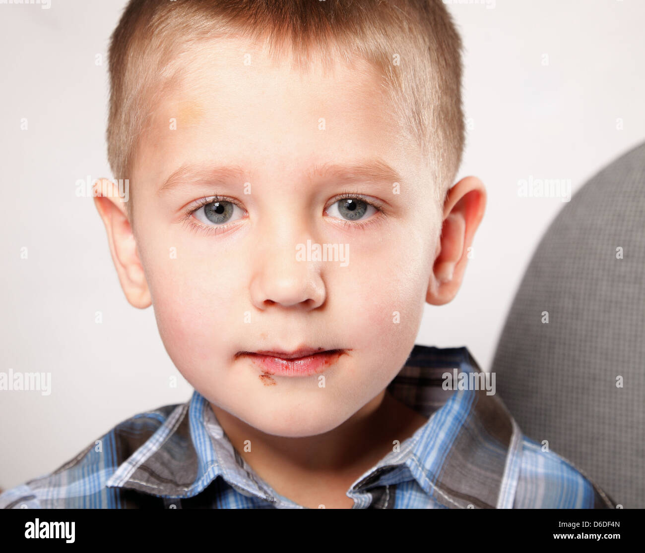 Closeup cute little boy with a chocolate on the face Stock Photo - Alamy